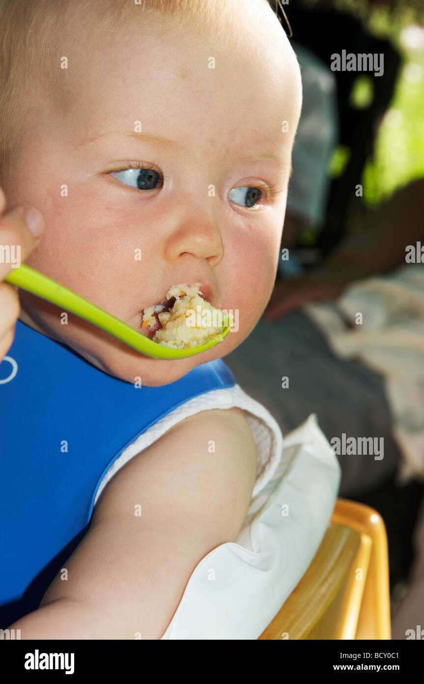 Baby is eating Stock Photo - Alamy