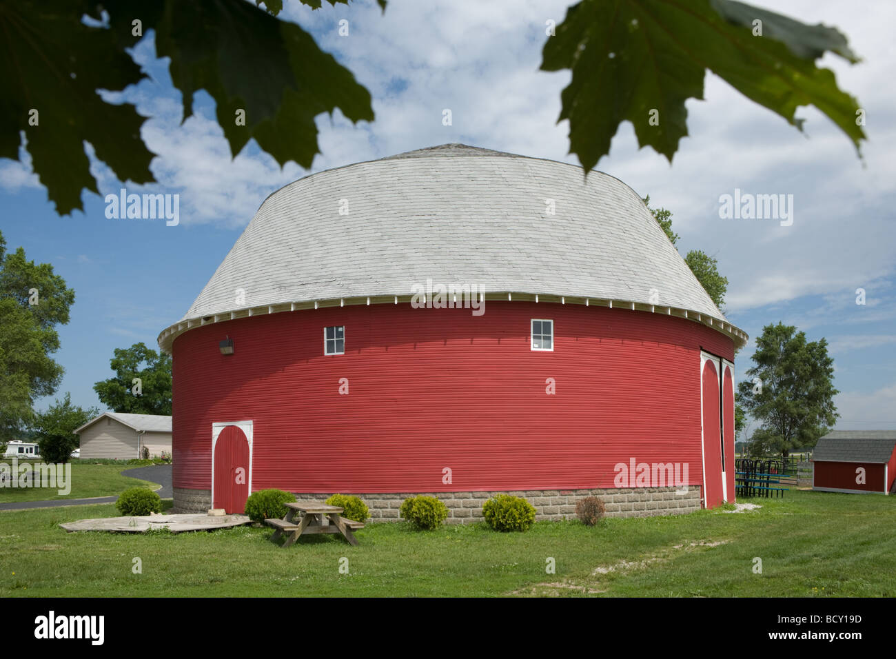 Round red barn on route twenty 20 in Indiana Stock Photo - Alamy