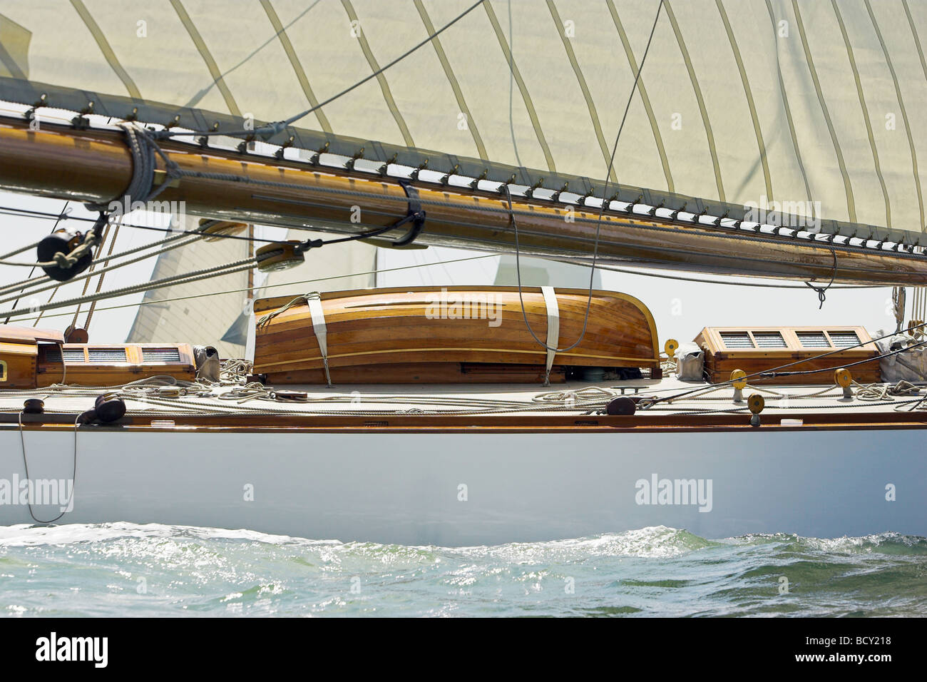 Wooden dinghy on classic yacht Stock Photo - Alamy