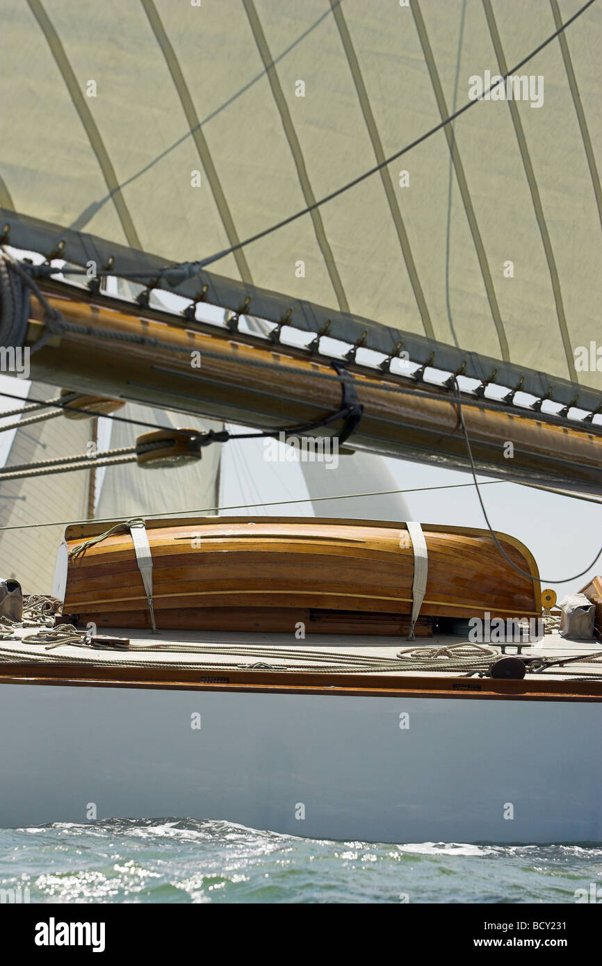 Wooden dinghy on classic yacht Stock Photo - Alamy