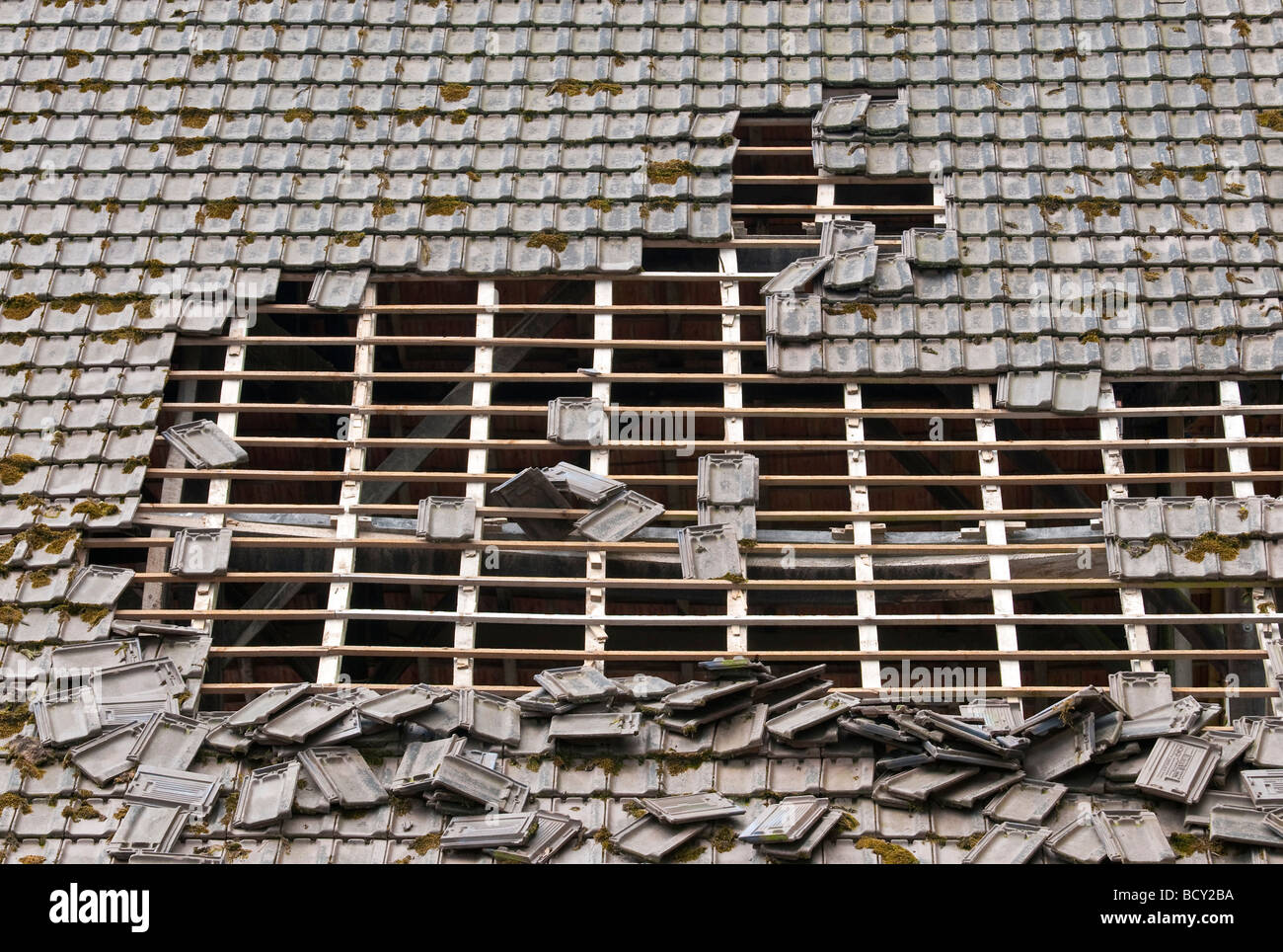 Storm damaged roof with displaced tiles - France Stock Photo - Alamy