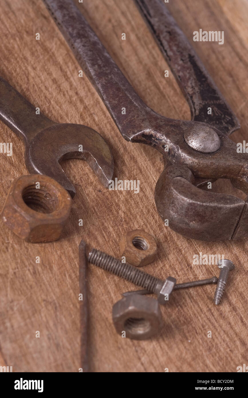 old rusty tools on woody table Stock Photo - Alamy