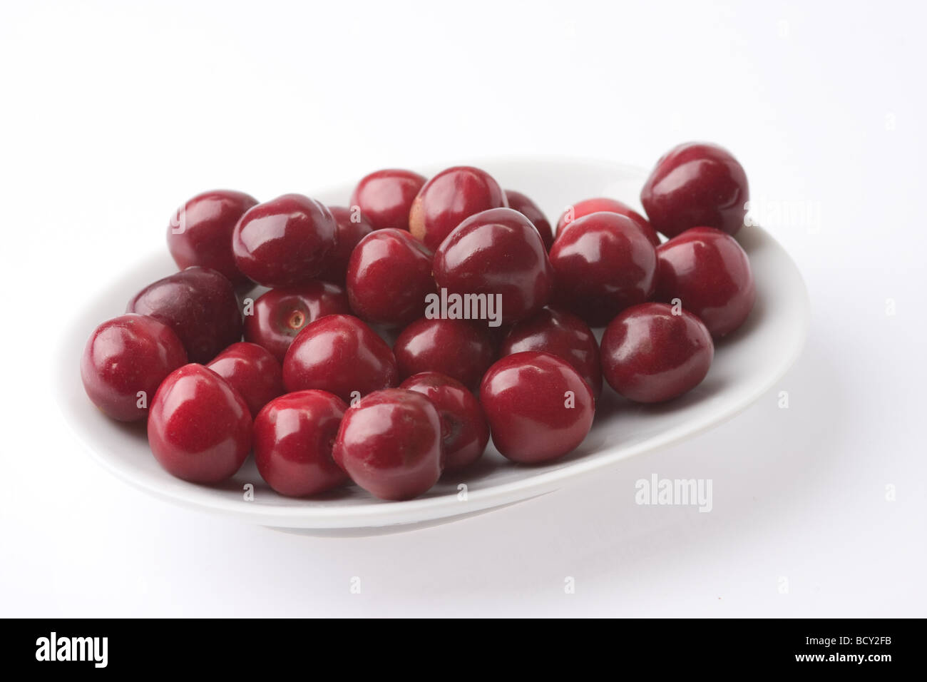 red cherry on white background Stock Photo - Alamy
