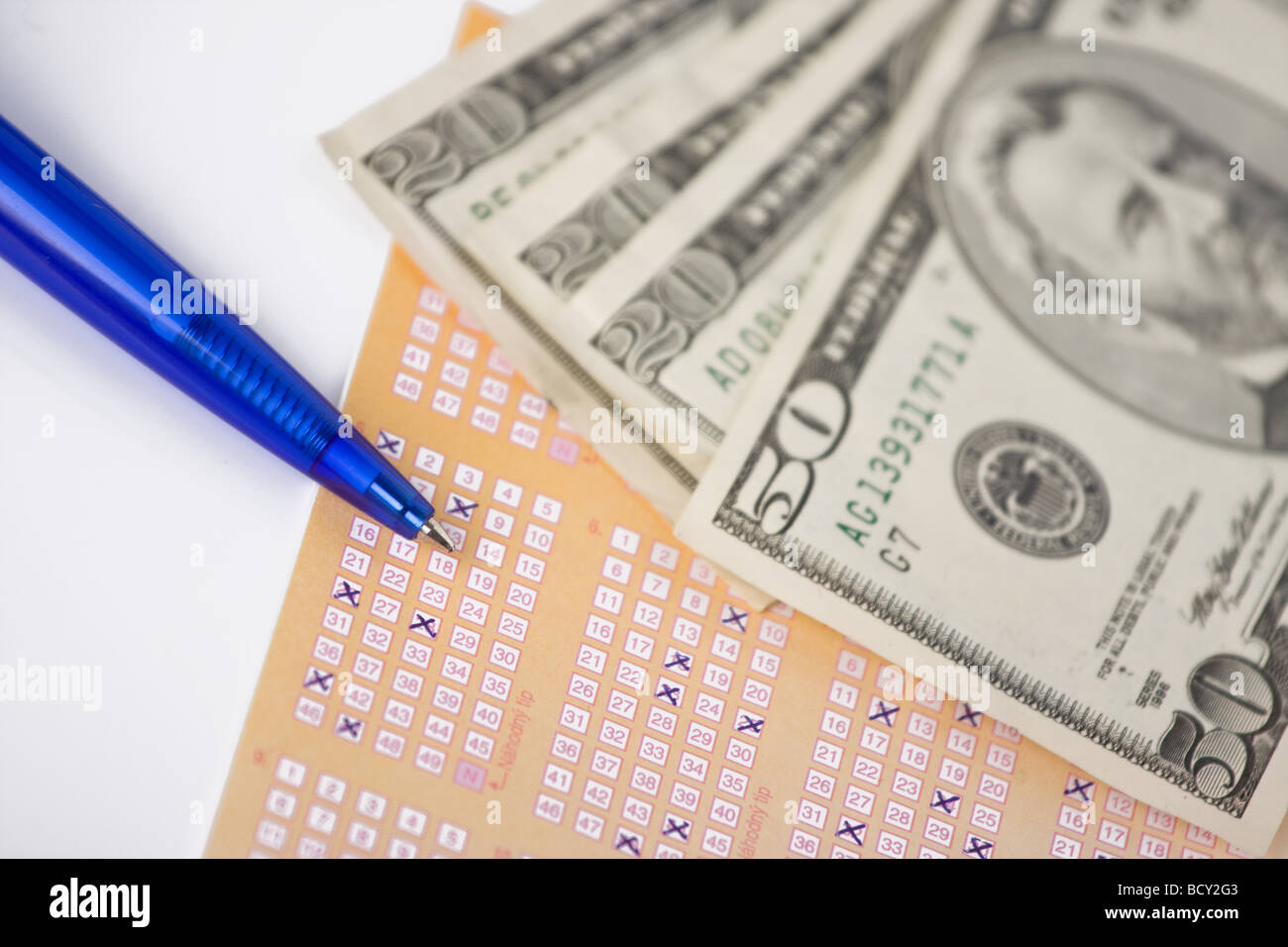 lottery ticket and money with blue pen Stock Photo - Alamy