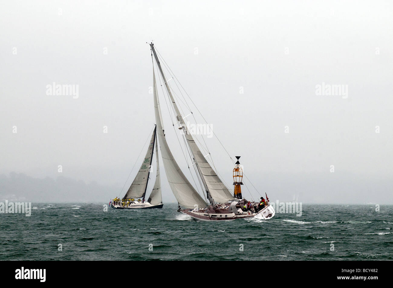 A pair of Yachts rounding the west bramble cardinal buoy in the Solent ...