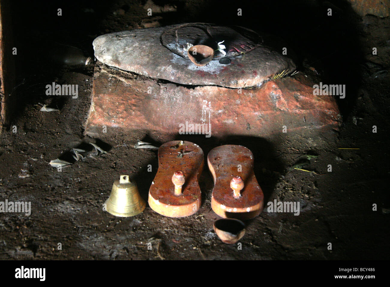 A bell and sandals of a Hindu saint outside of the Kavla (Kavala) Caves ...