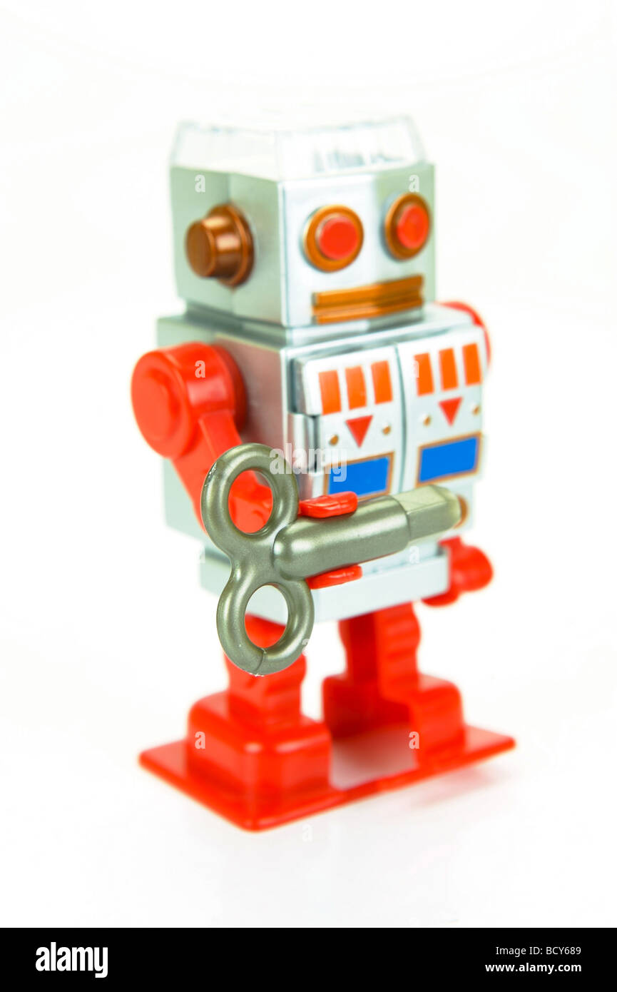 A toy robot isolated against a white background Stock Photo - Alamy