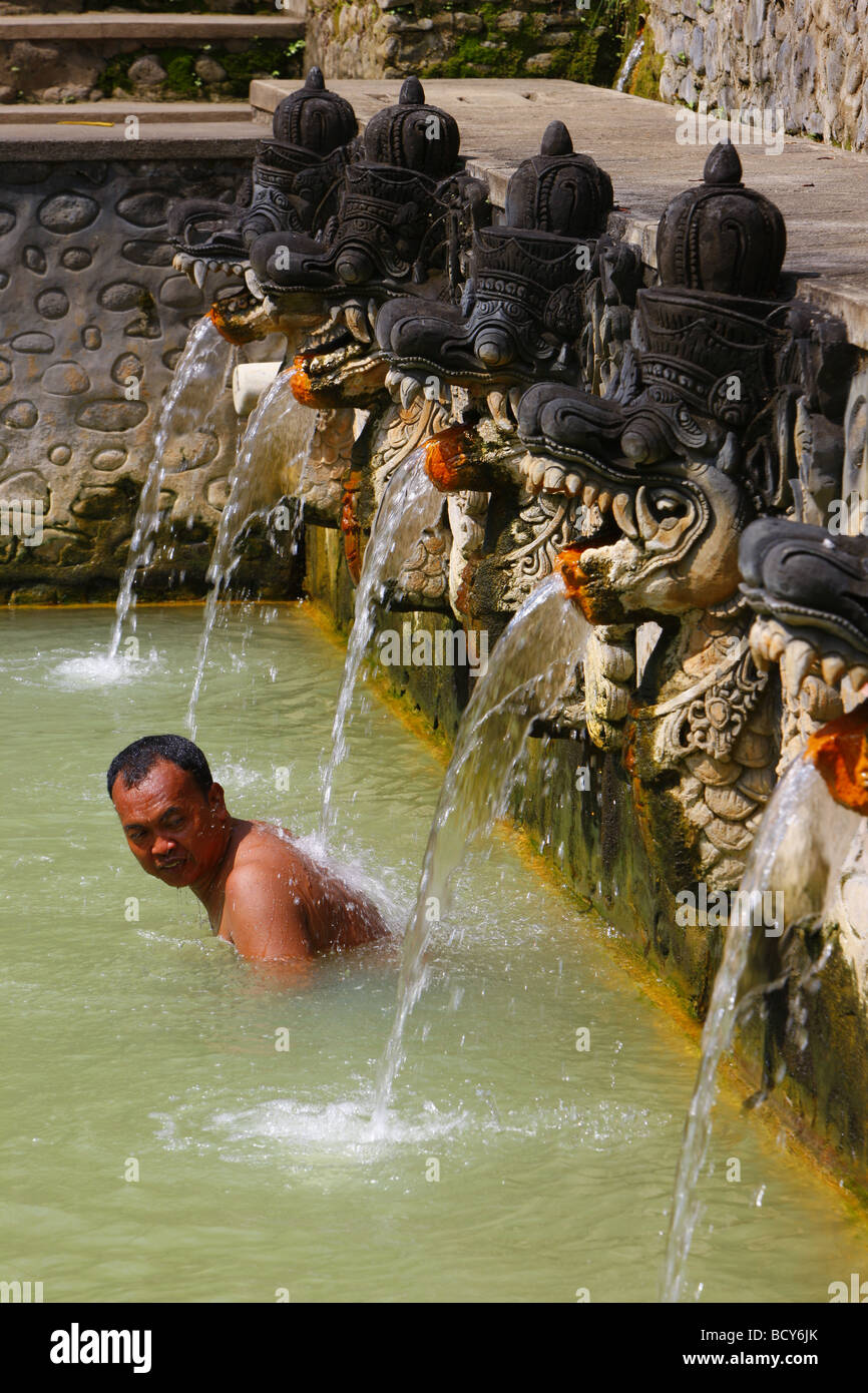 Man, old bath with hot springs in Ambengan, Bali, Republic of Indonesia ...