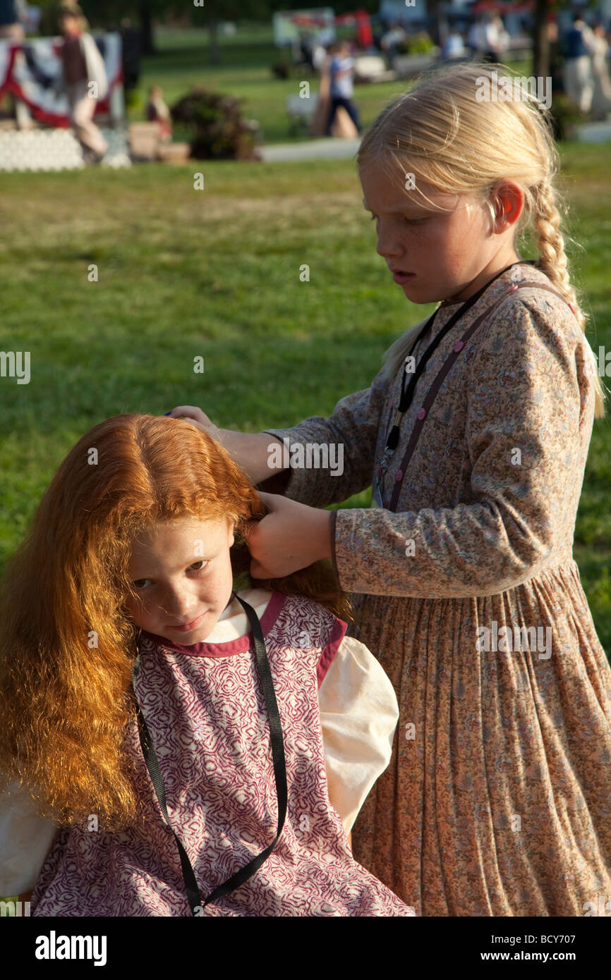 Girl braids another's hair at restored Mormon village of Nauvoo ...