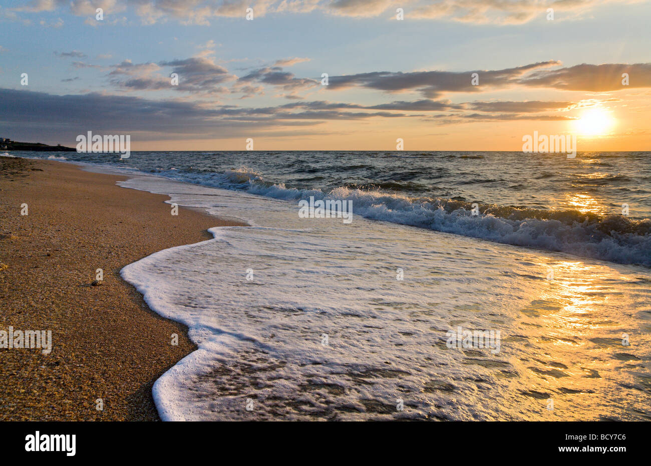Sea sunset surf great wave break on sandy coastline Stock Photo - Alamy