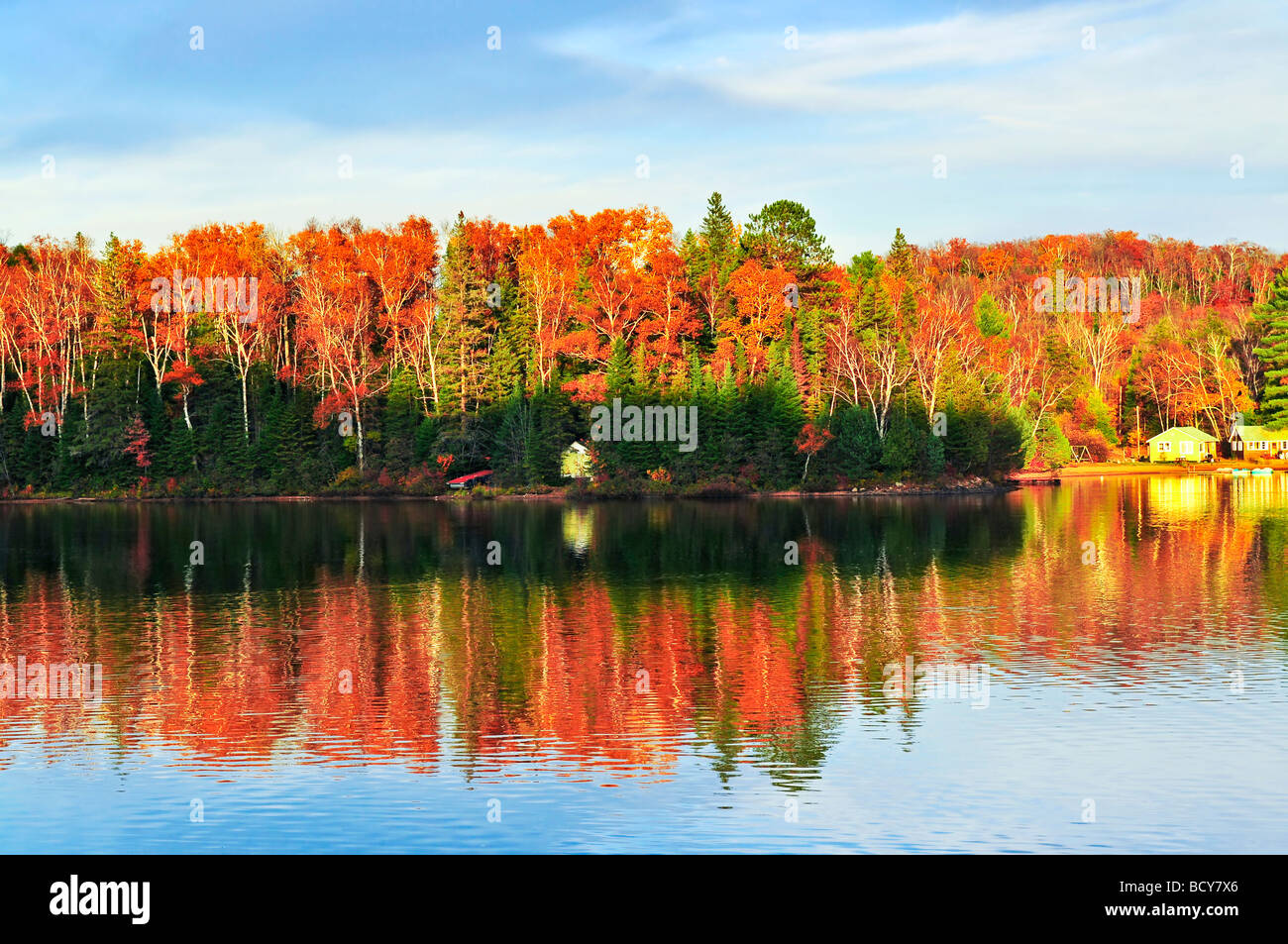 Red and orange fall trees and their lake reflection hi-res stock ...