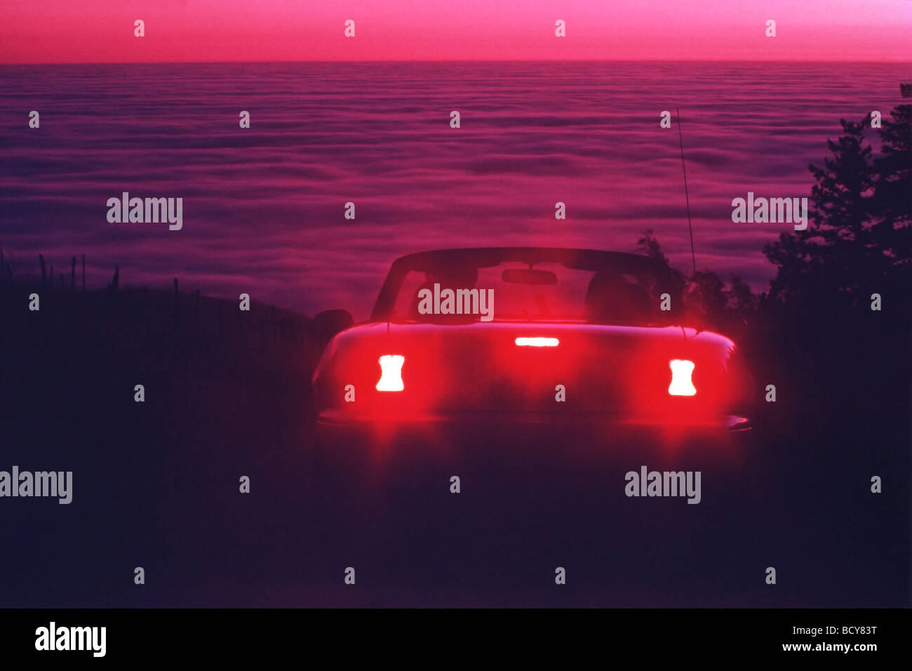 rear view of convertible at sunset Stock Photo - Alamy