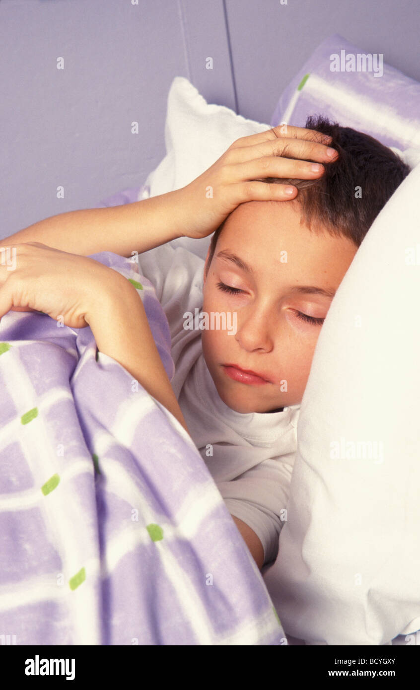 young boy sick in bed Stock Photo - Alamy