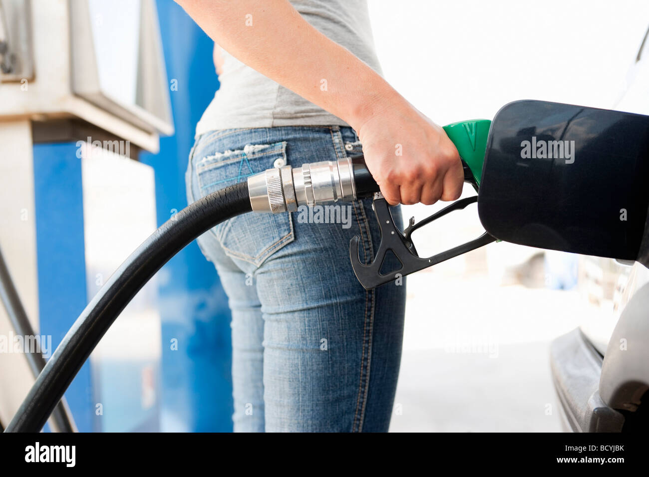 Young Woman Filling Up at the Gas Station Stock Photo - Alamy
