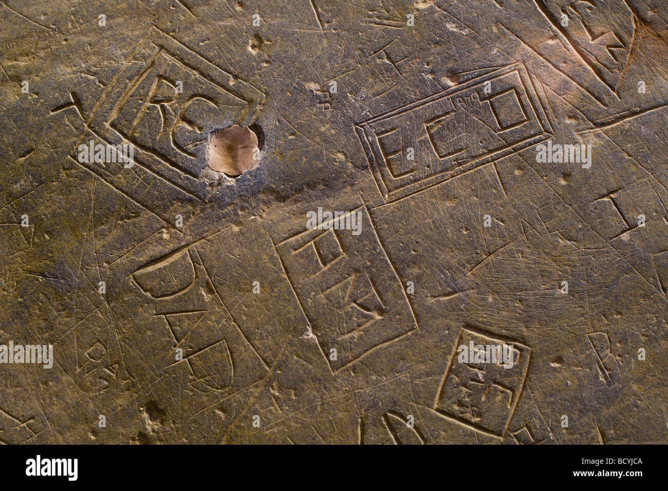 Initials carved into a slate slab by school pupils of the former Ardwyn ...
