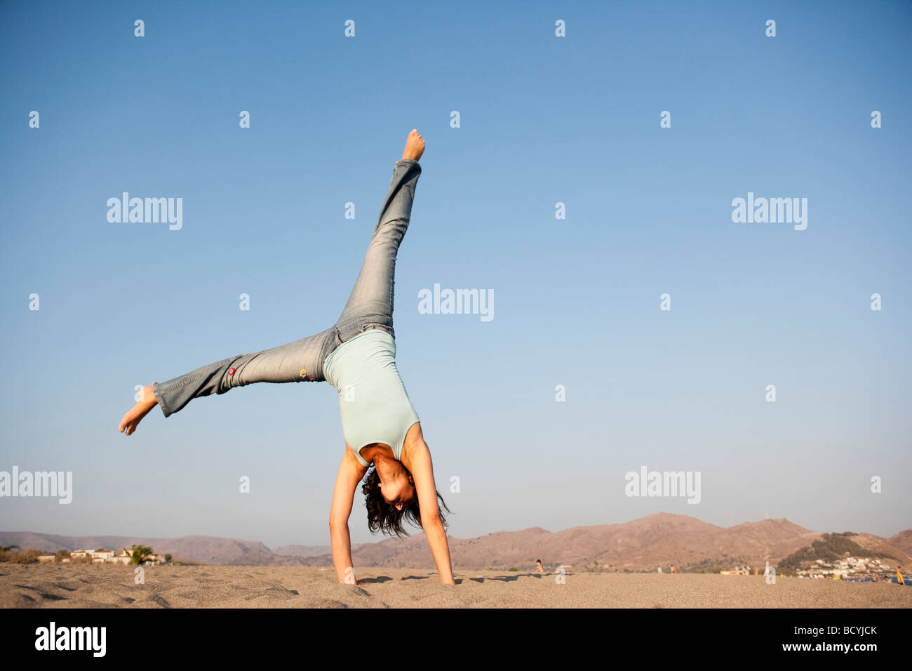 Young Woman Turning Wheels Stock Photo - Alamy