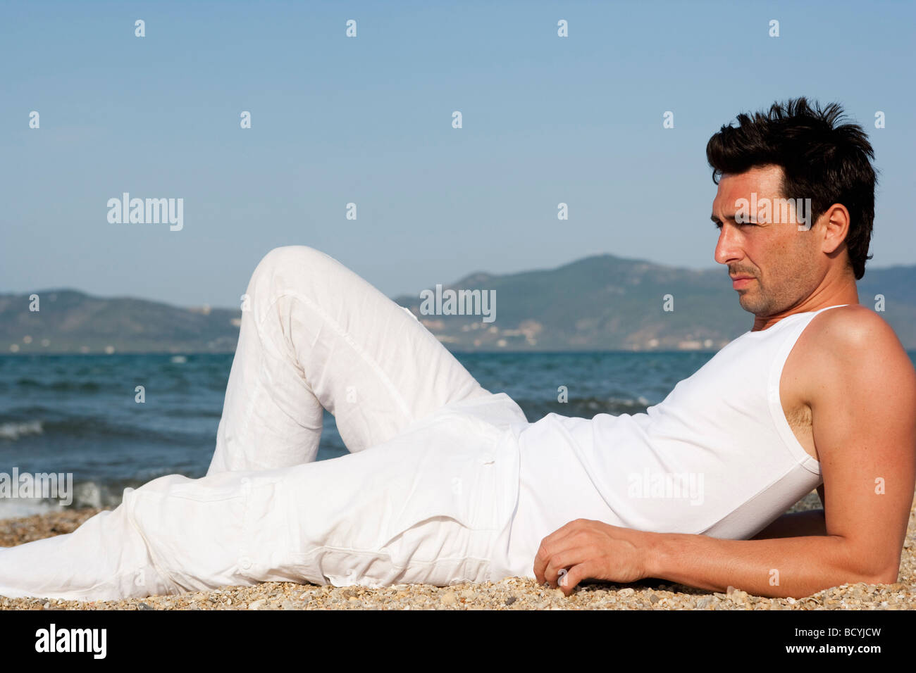 Man On Beach Enjoying Sun Stock Photo - Alamy