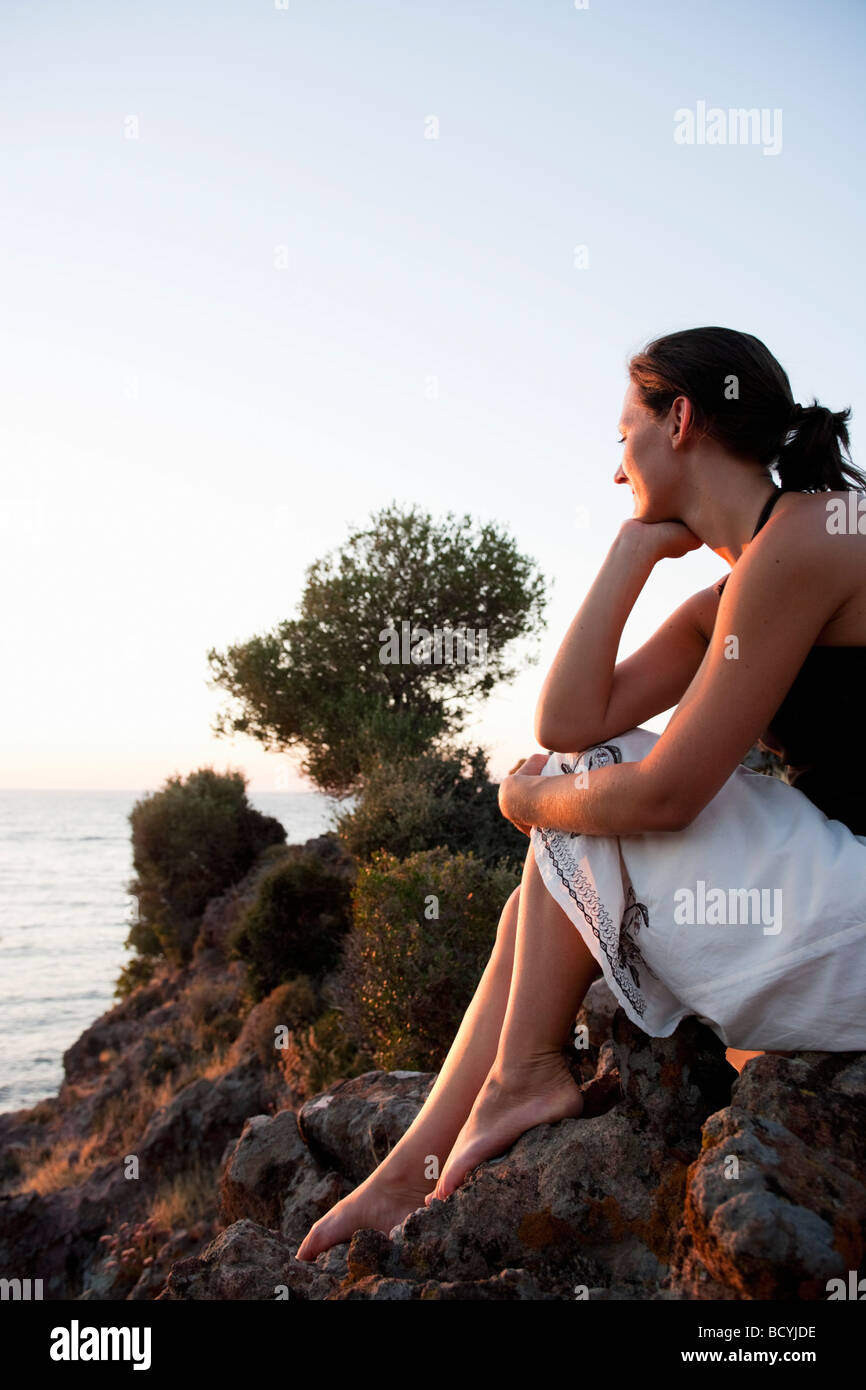 Woman enjoying seaside scene in hi-res stock photography and images - Alamy