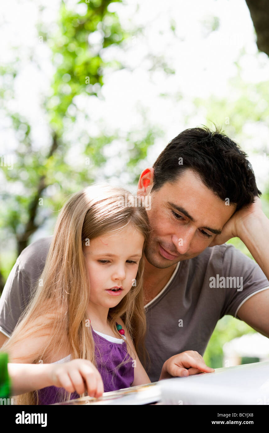 Father And Daughter Learning Stock Photo - Alamy