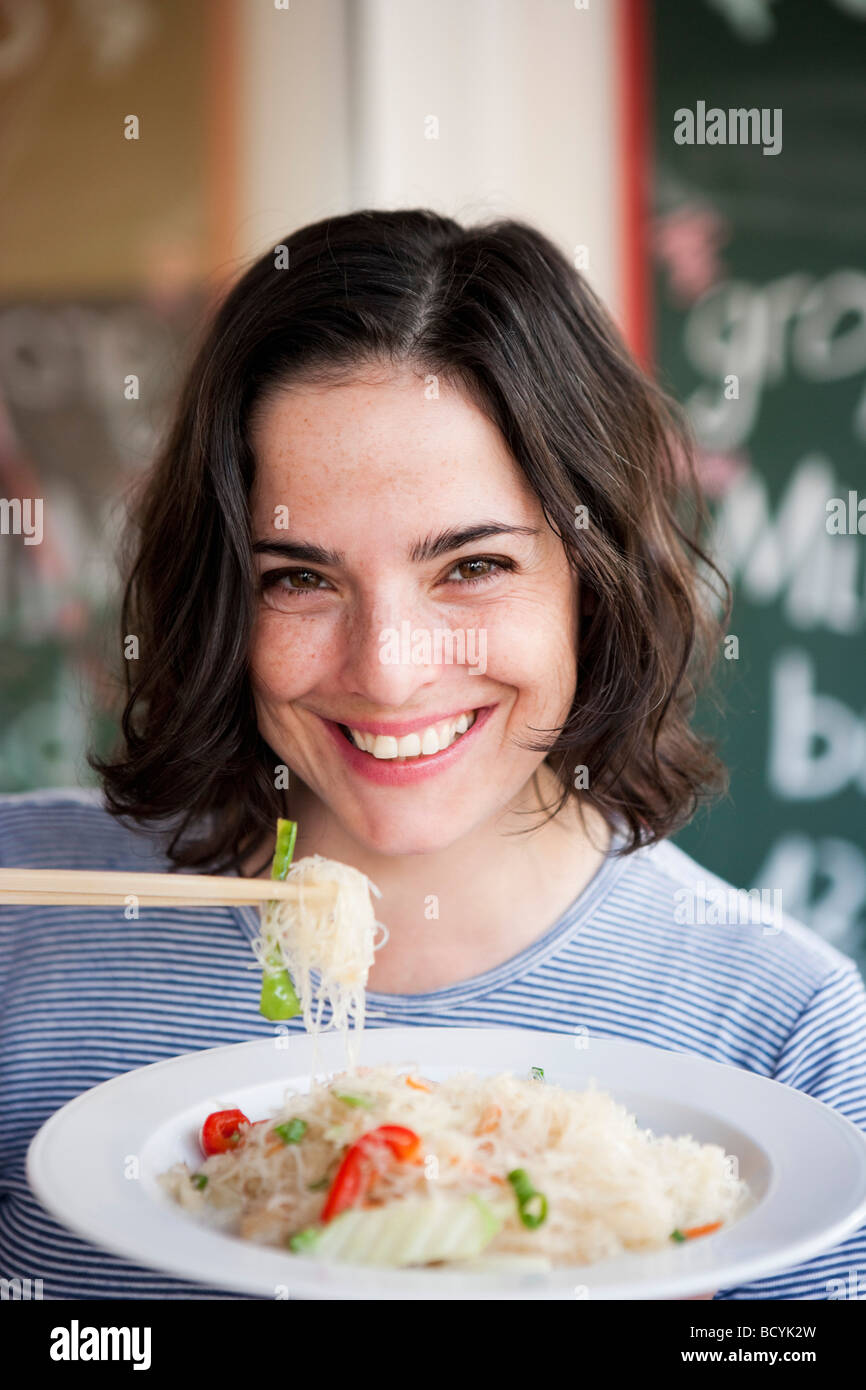 Woman noodles looking at camera hi-res stock photography and images - Alamy