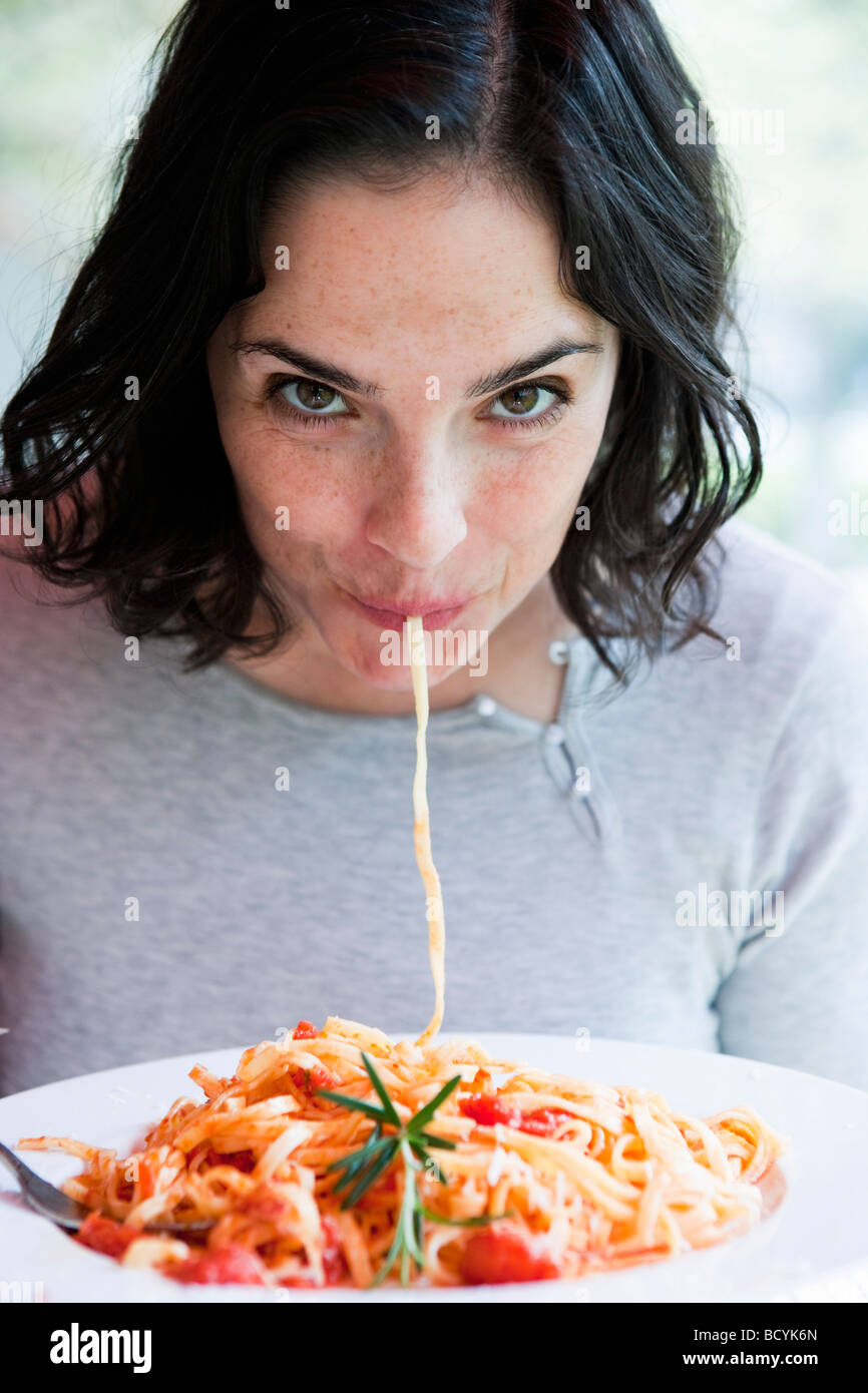 Woman Eating Spaghetti Stock Photo - Alamy