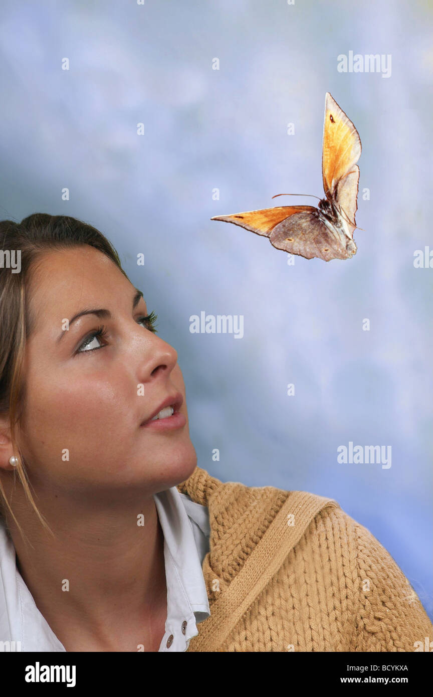 young woman with butterfly Stock Photo - Alamy