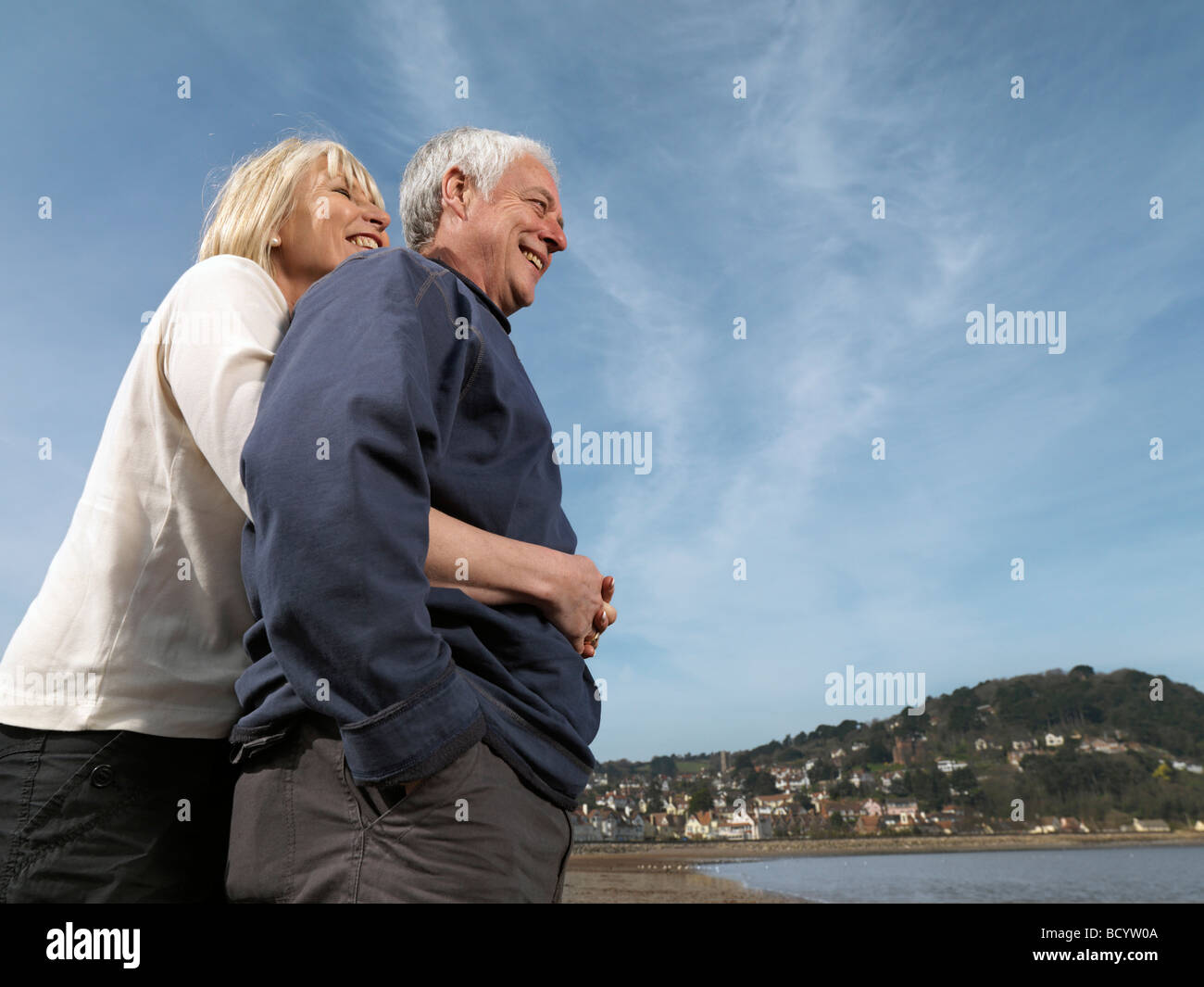 Mature couple hugging waterfront hi-res stock photography and images ...