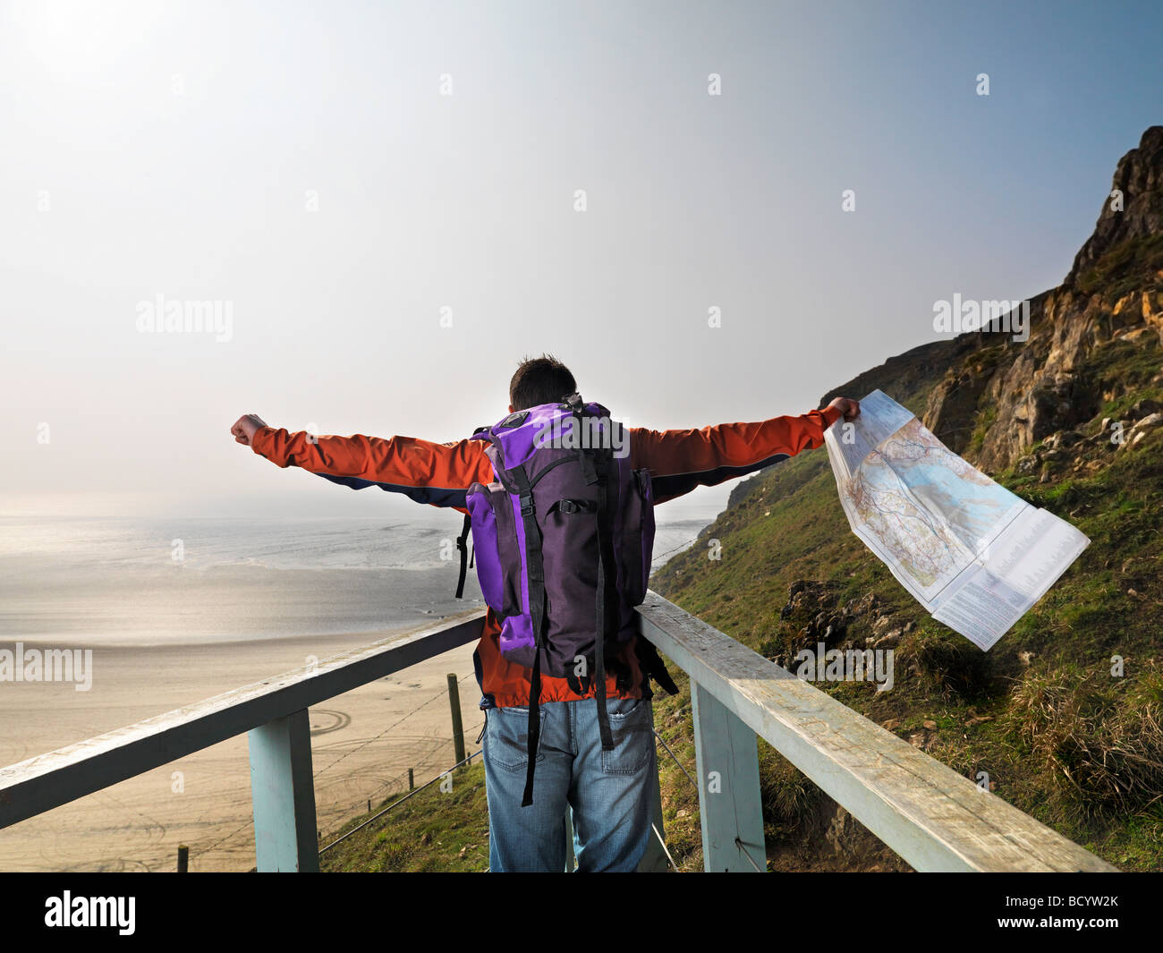 man hiking on cliff edge Stock Photo - Alamy