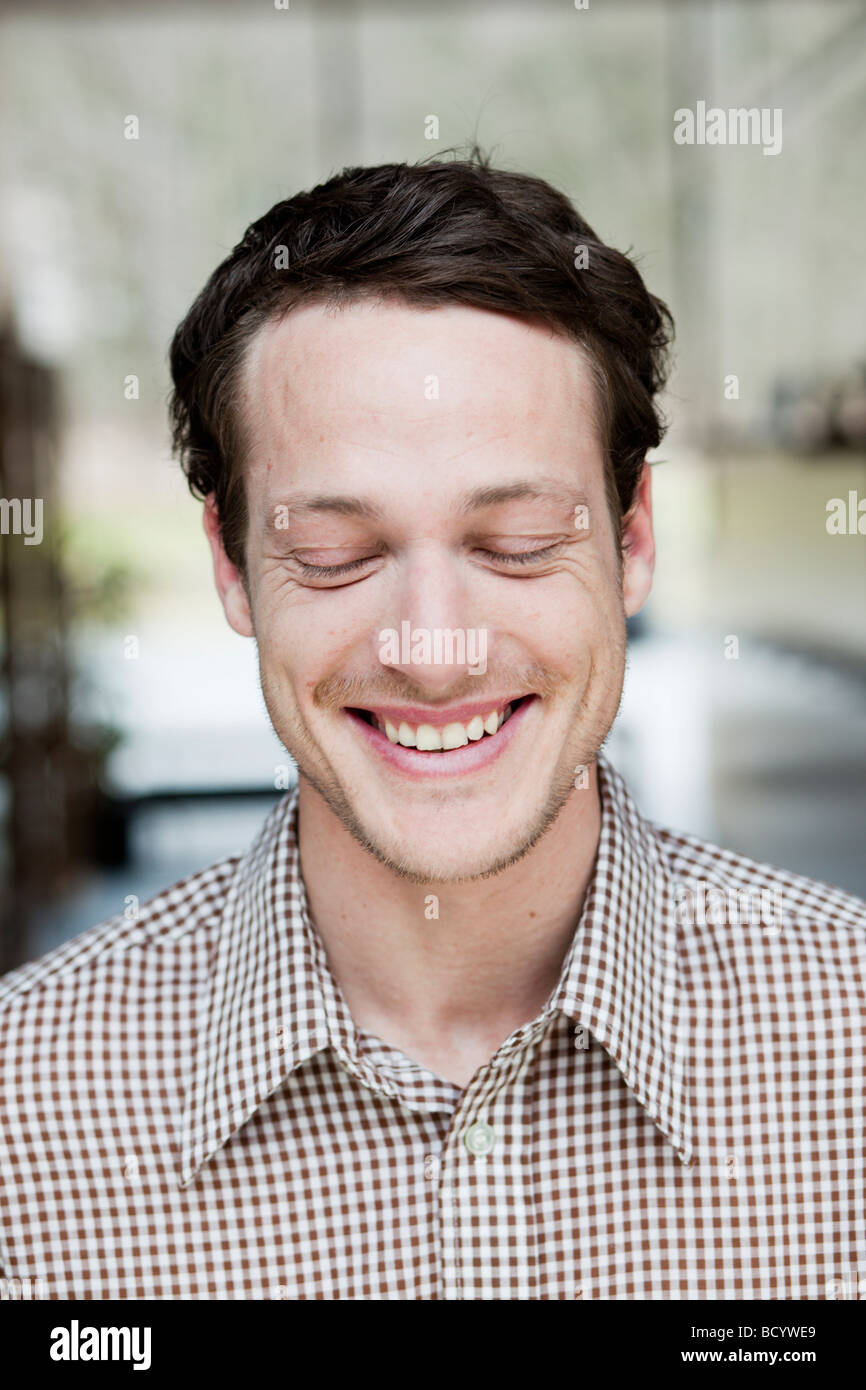man smiling eyes closed Stock Photo - Alamy