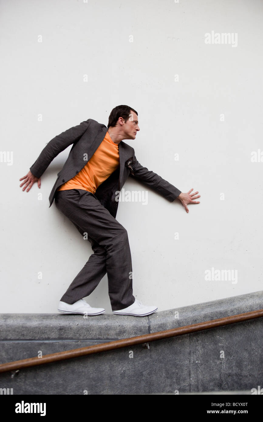 man walking on railing Stock Photo - Alamy