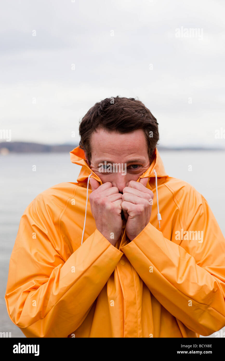 Hiding his face with his coat hi-res stock photography and images - Alamy