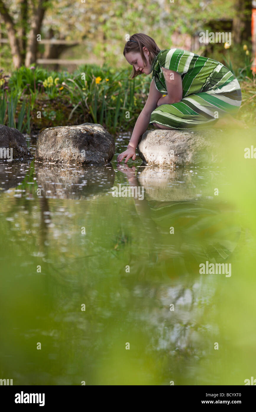 young girl at pond Stock Photo - Alamy