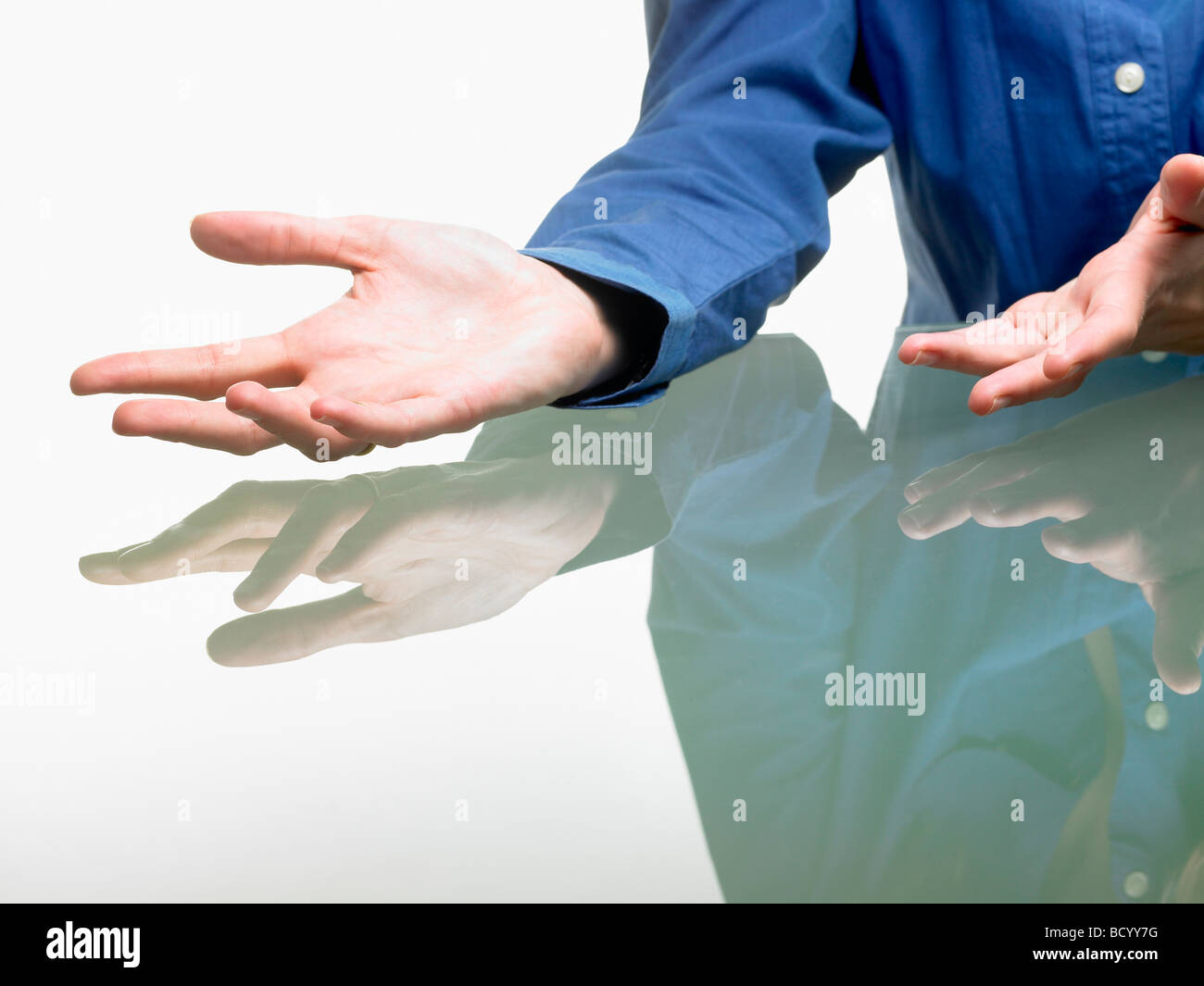 Hands of a woman on table Stock Photo - Alamy