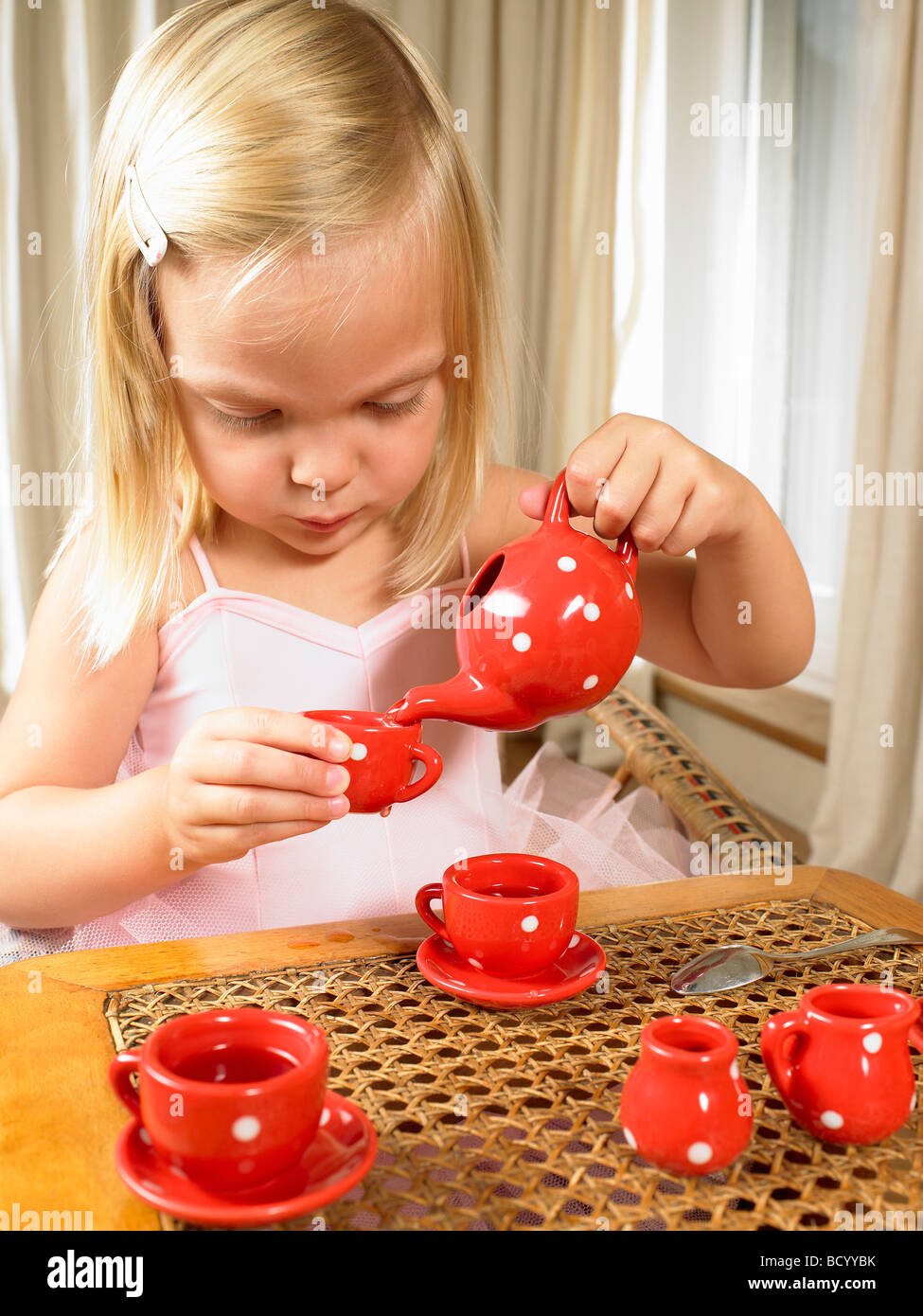 Girl having a tea time Stock Photo - Alamy