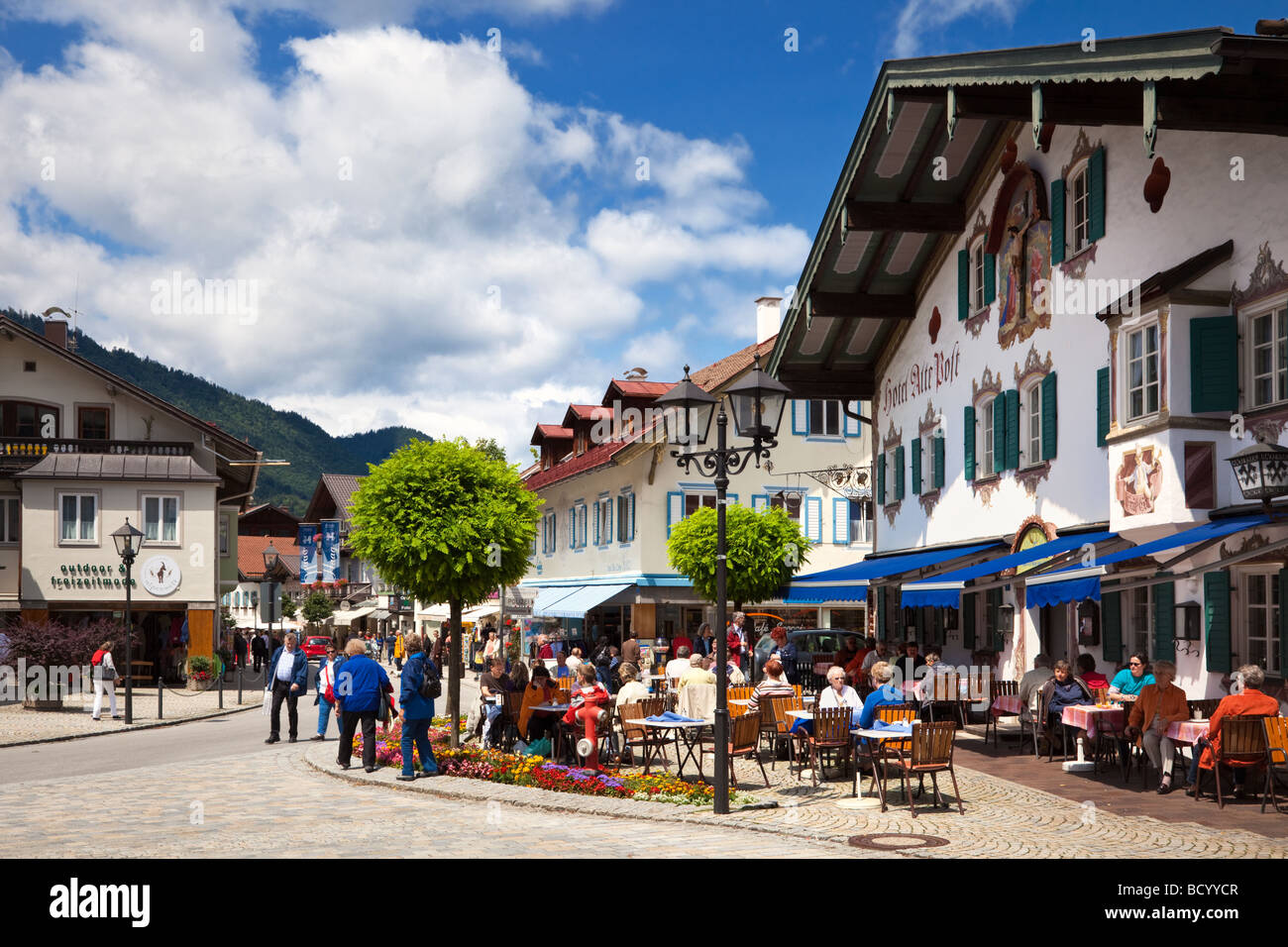 Oberammergau town centre street scene with people at pavement cafes ...