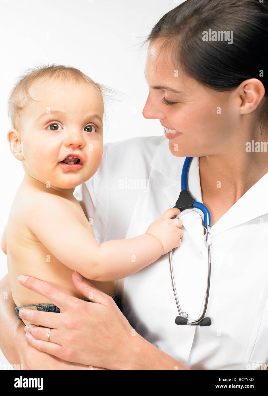 Doctor carrying baby boy Stock Photo - Alamy