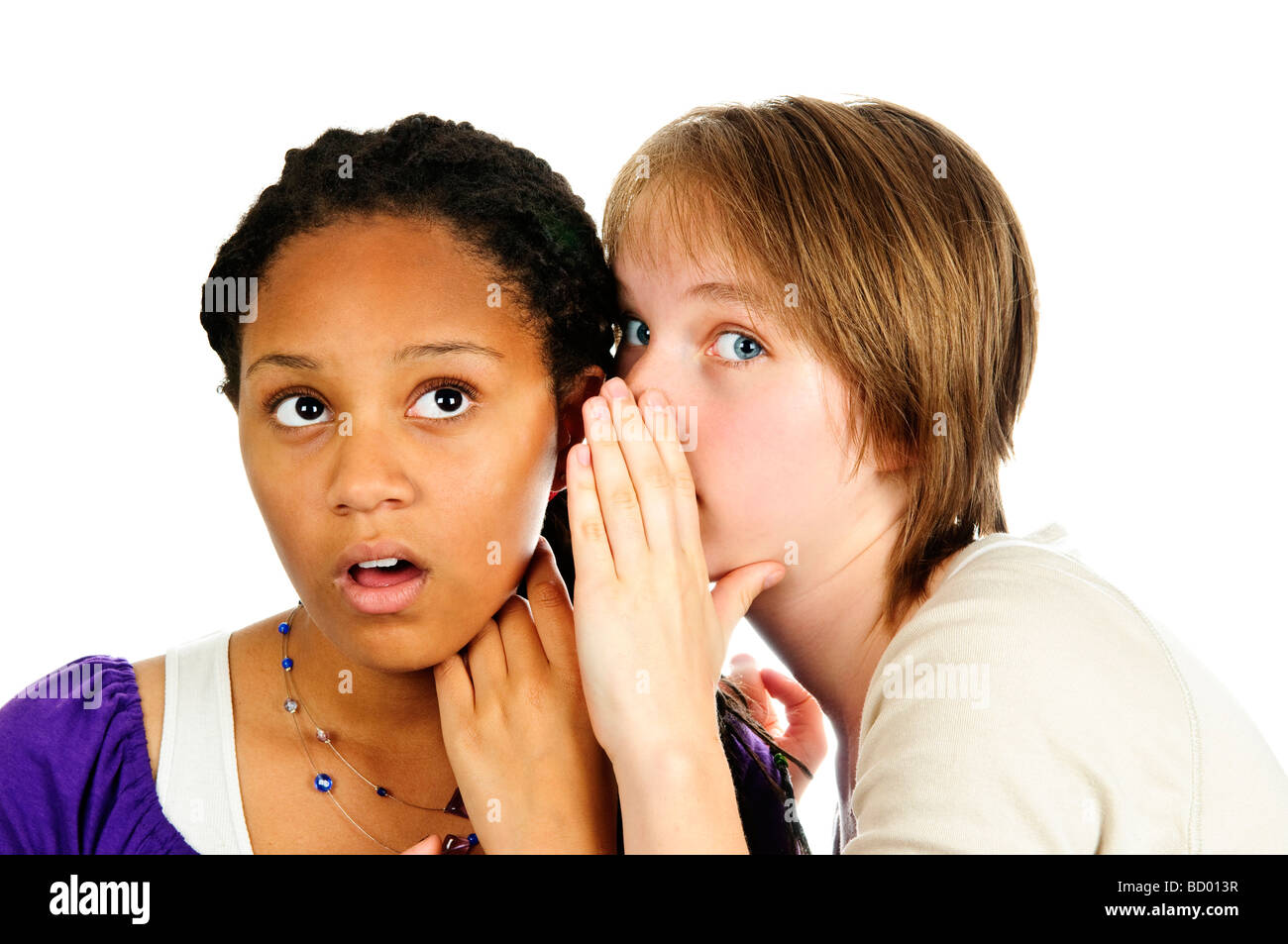 Isolated portrait of two diverse teenage girl friends gossiping Stock ...