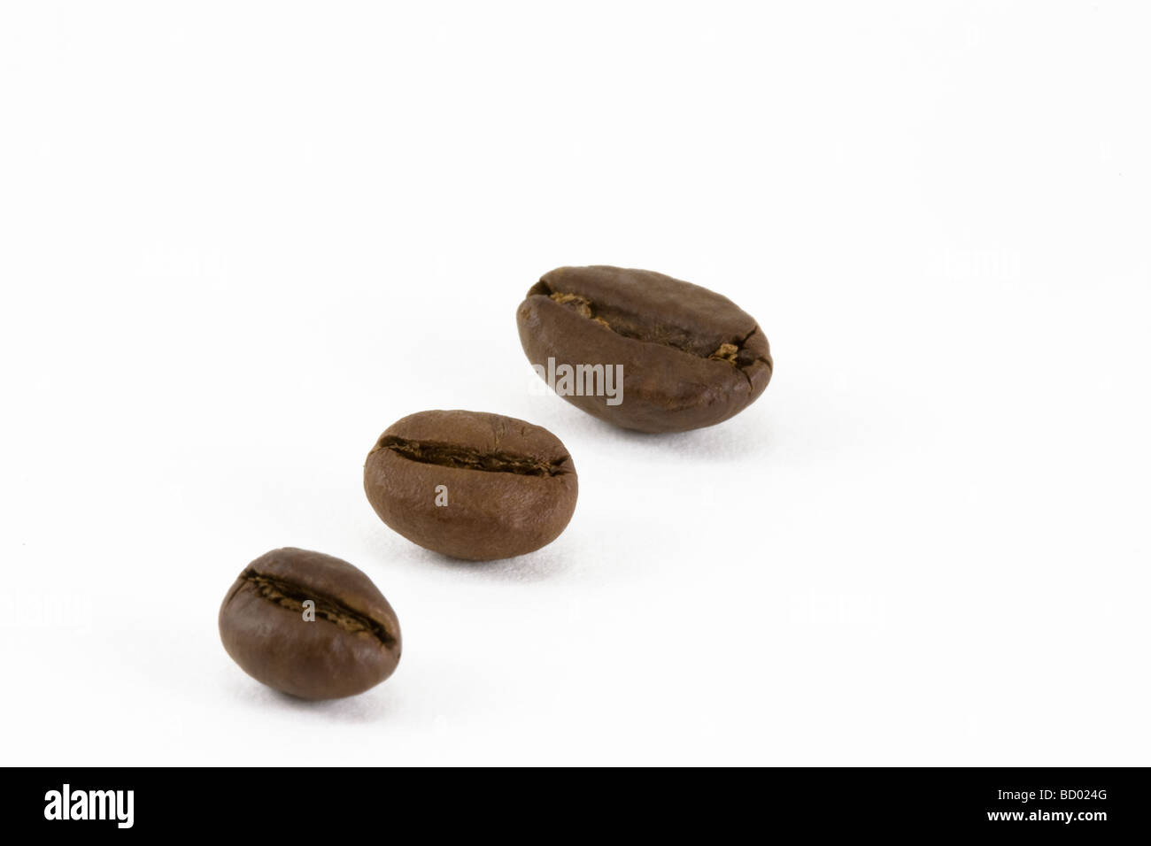 Three Coffee Beans Stock Photo - Alamy