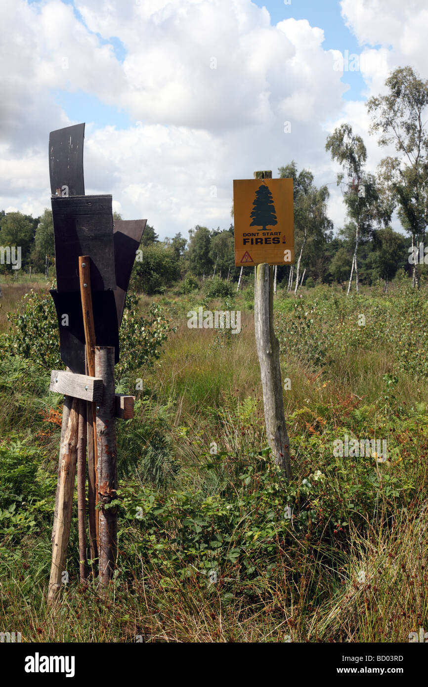 Fire beaters and warning sign, Stedham Common, West Sussex, UK Stock ...
