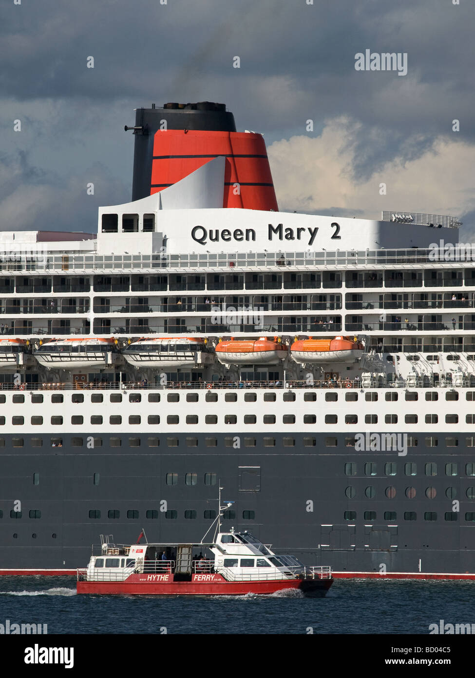 Cunard's Queen Mary 2 in Southampton UK with the Hythe ferry passing by ...