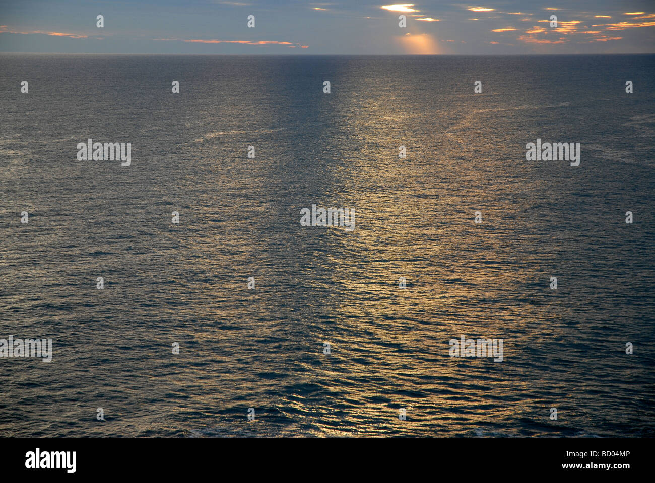 Golden sun reflecting on sea hi-res stock photography and images - Alamy