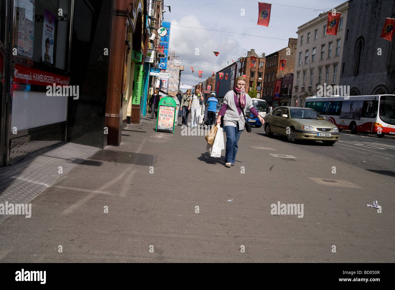 People out shopping main street in Limerick Ireland Stock Photo - Alamy