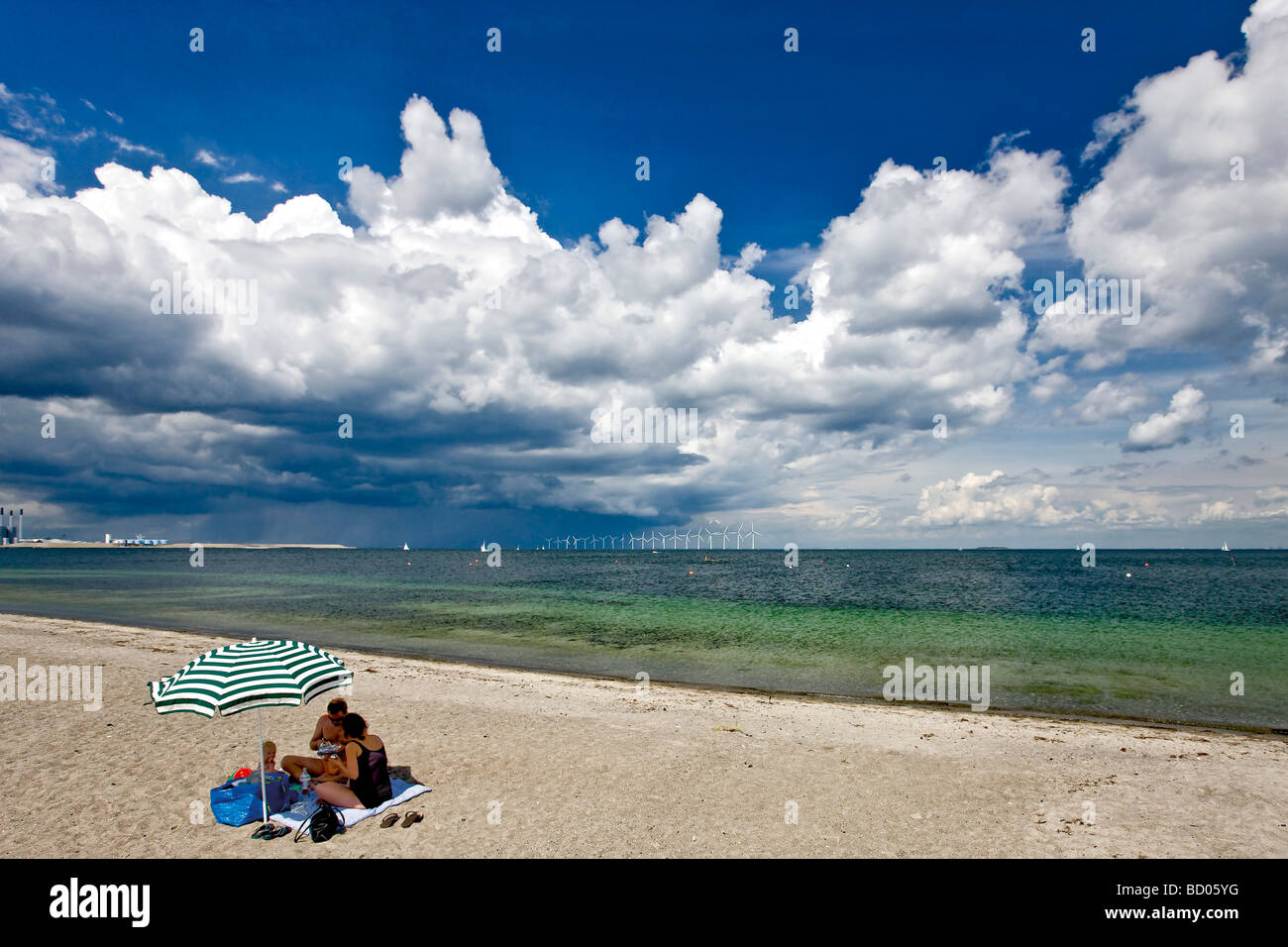 Family relaxing on the beach at Amager Strandpark, Copenhagen, Denmark ...