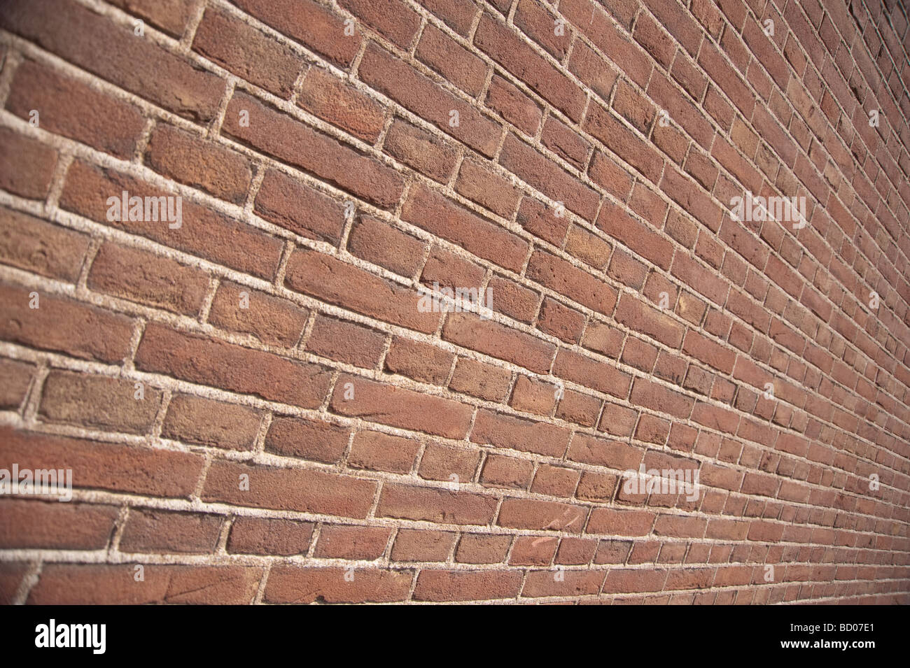 Pattern of a red stone brick wall taken from an angle Stock Photo - Alamy