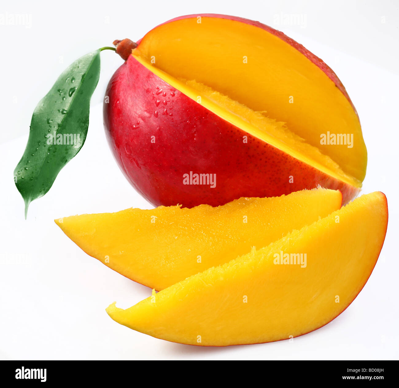 Mango with section on a white background Stock Photo - Alamy