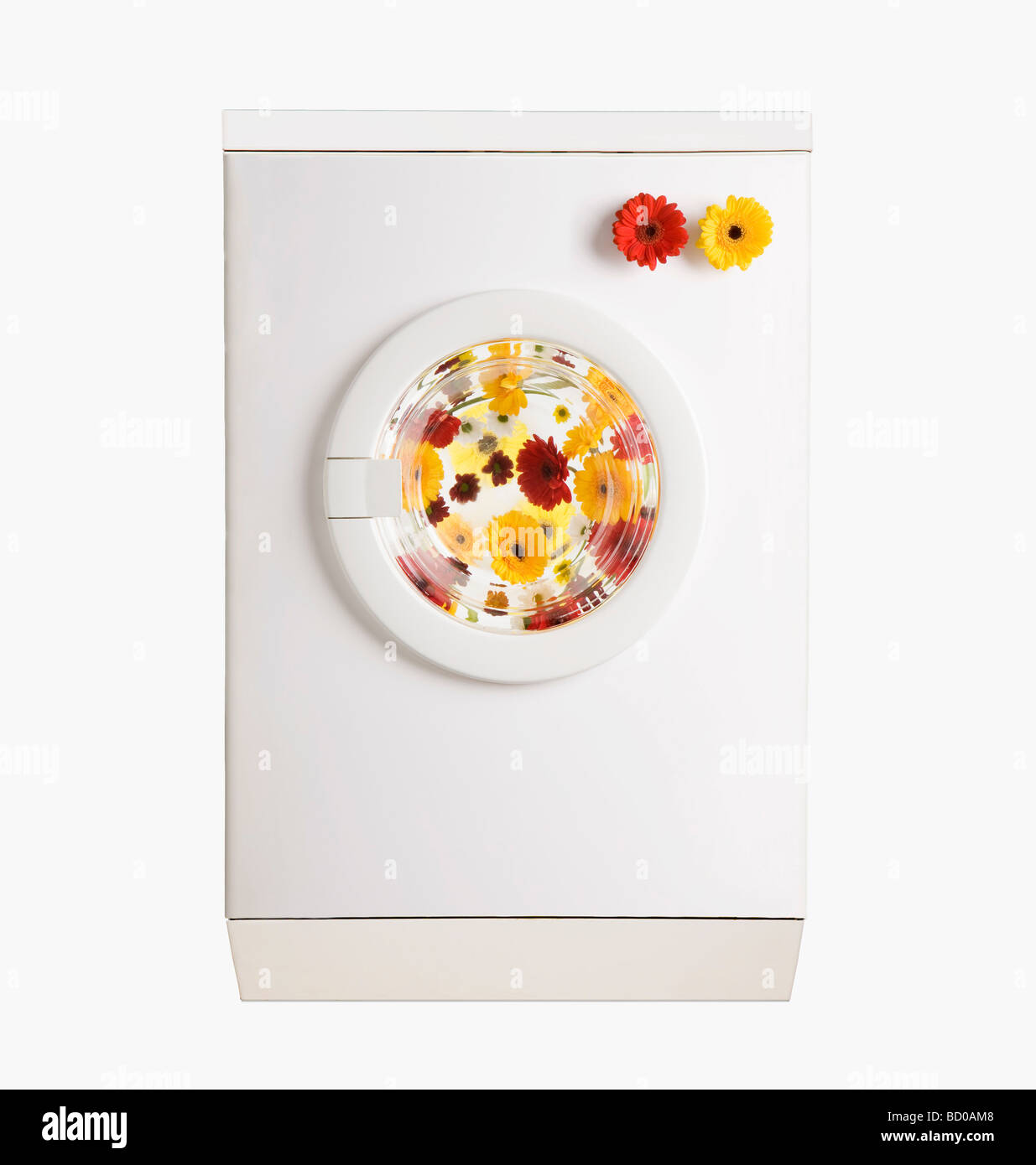 A washing machine with flowers inside Stock Photo - Alamy