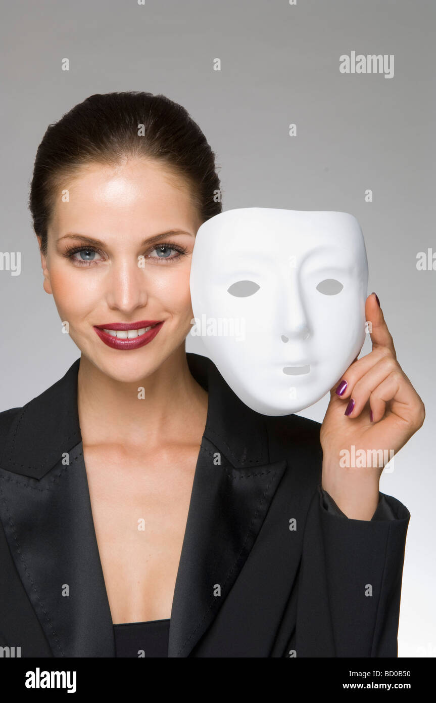 Female as business woman with mask Stock Photo - Alamy