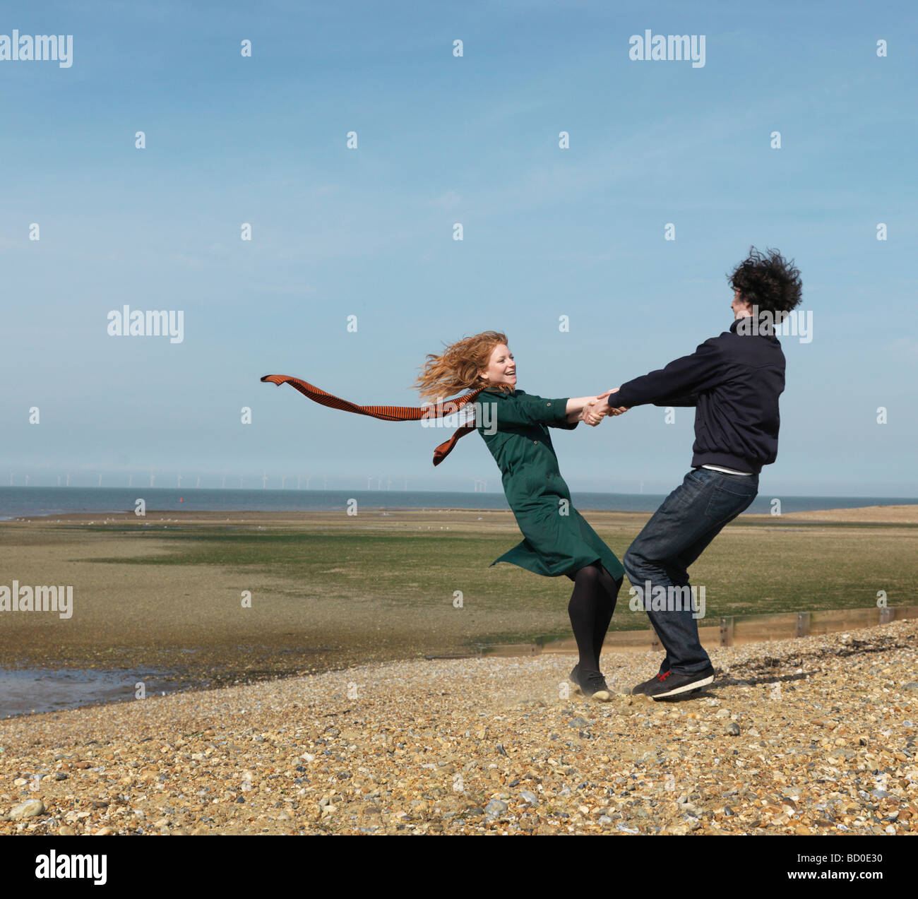 Couple spinning each other around Stock Photo - Alamy