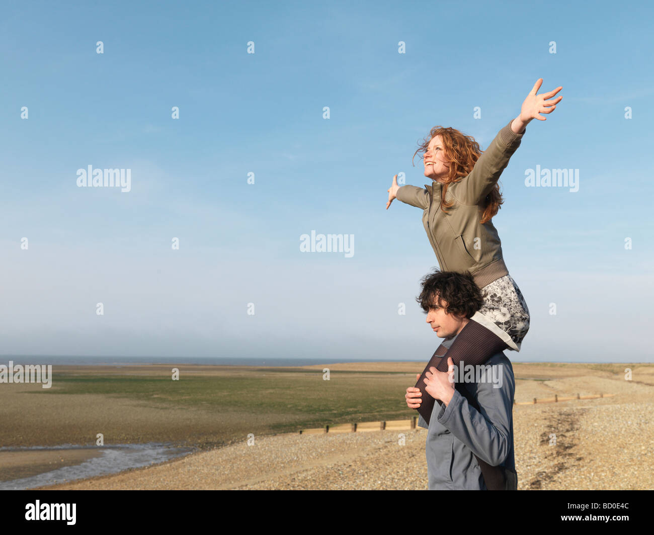 Man Carrying Girlfriend On Shoulders Stock Photos & Man Carrying ...