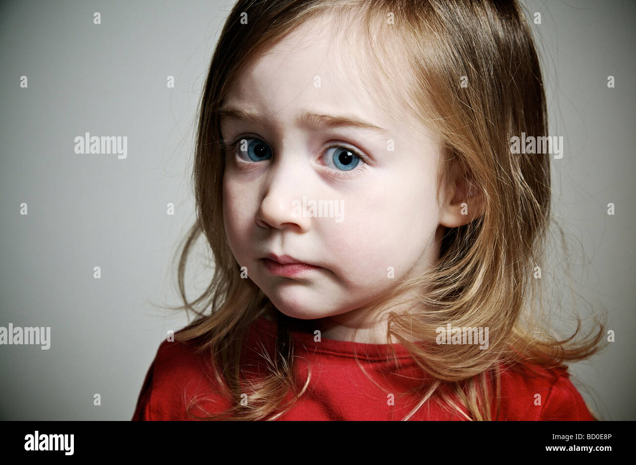 Little girl with red sweater looking at the camera, Otterburn Park ...